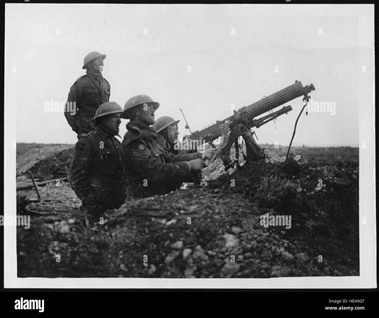 A historic photograph capturing a machine gun firing at a Boche plane ...