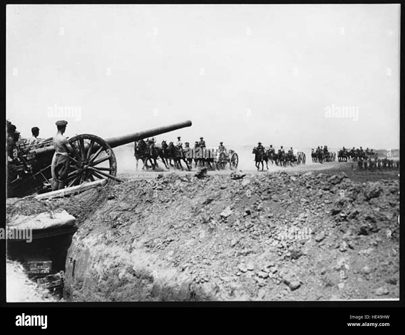 This historical image depicts a heavy gun in action, illustrating ...
