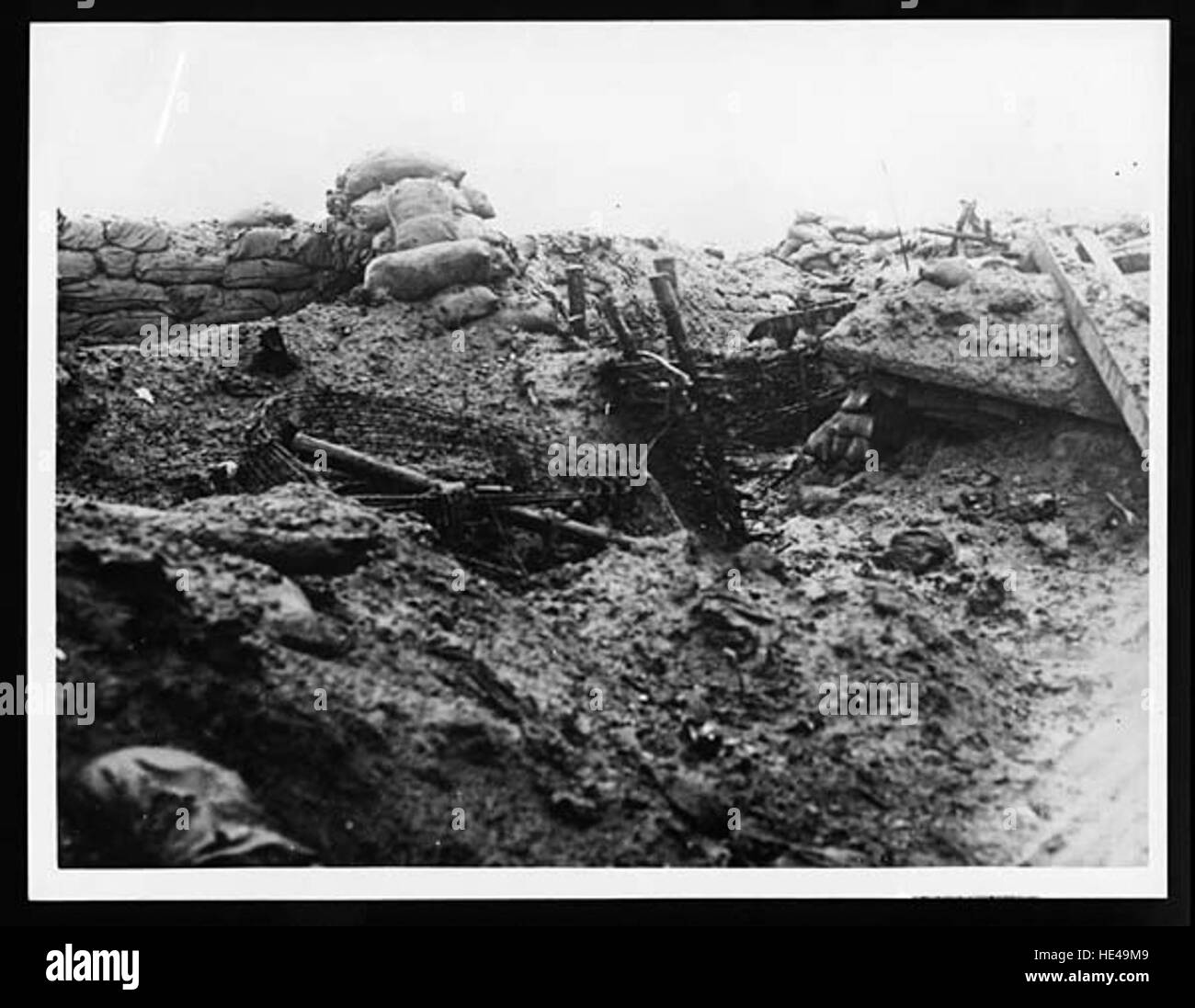 This photograph captures a deserted trench from World War I, showing ...