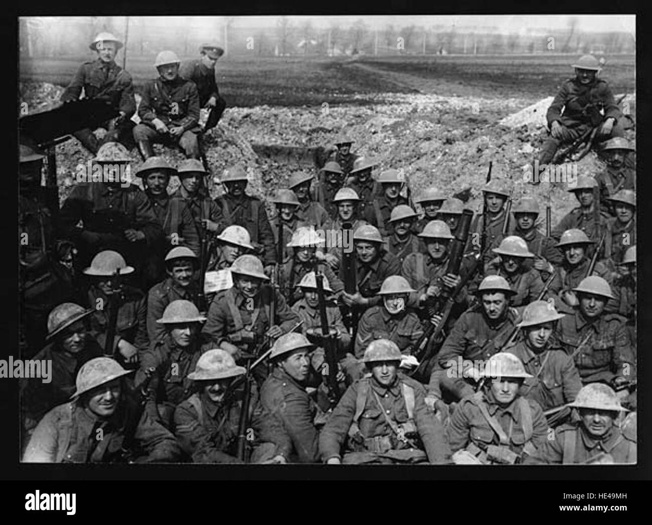 This historic image shows a group of soldiers in the trenches during a ...