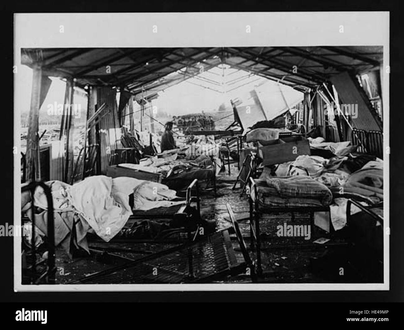 This image captures the aftermath of an air raid on a hospital ...