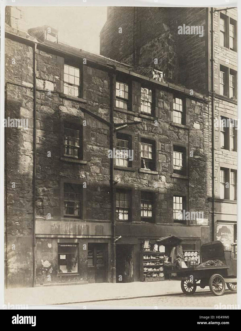 Three storey building with shops on the ground floor Stock Photo - Alamy