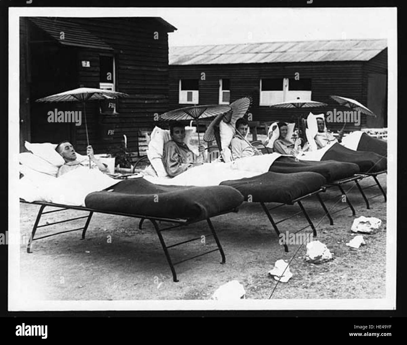 This historic photograph from World War I shows five soldiers resting ...