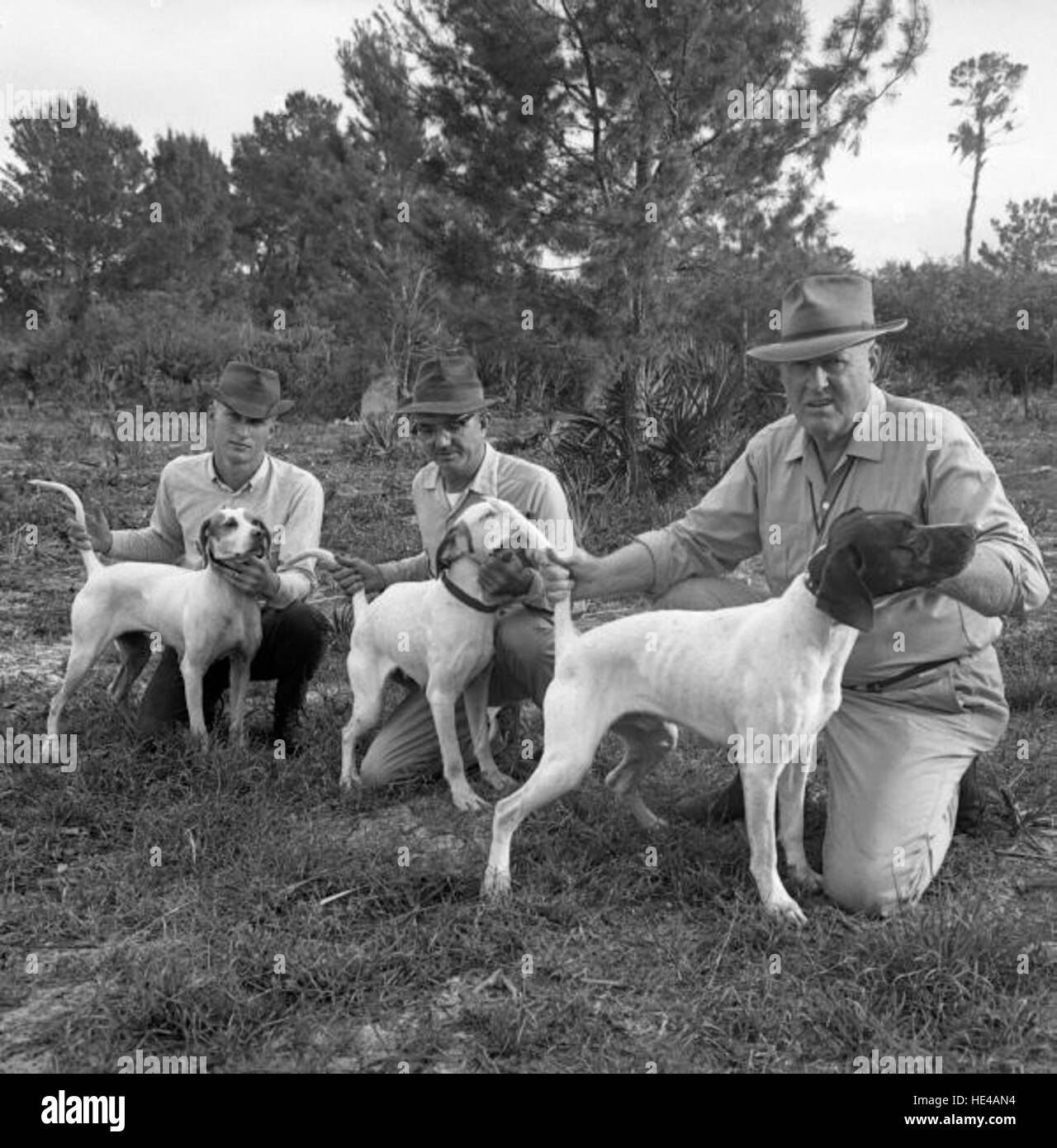 This historic image shows men in the Ruskin area, using pointers in a ...