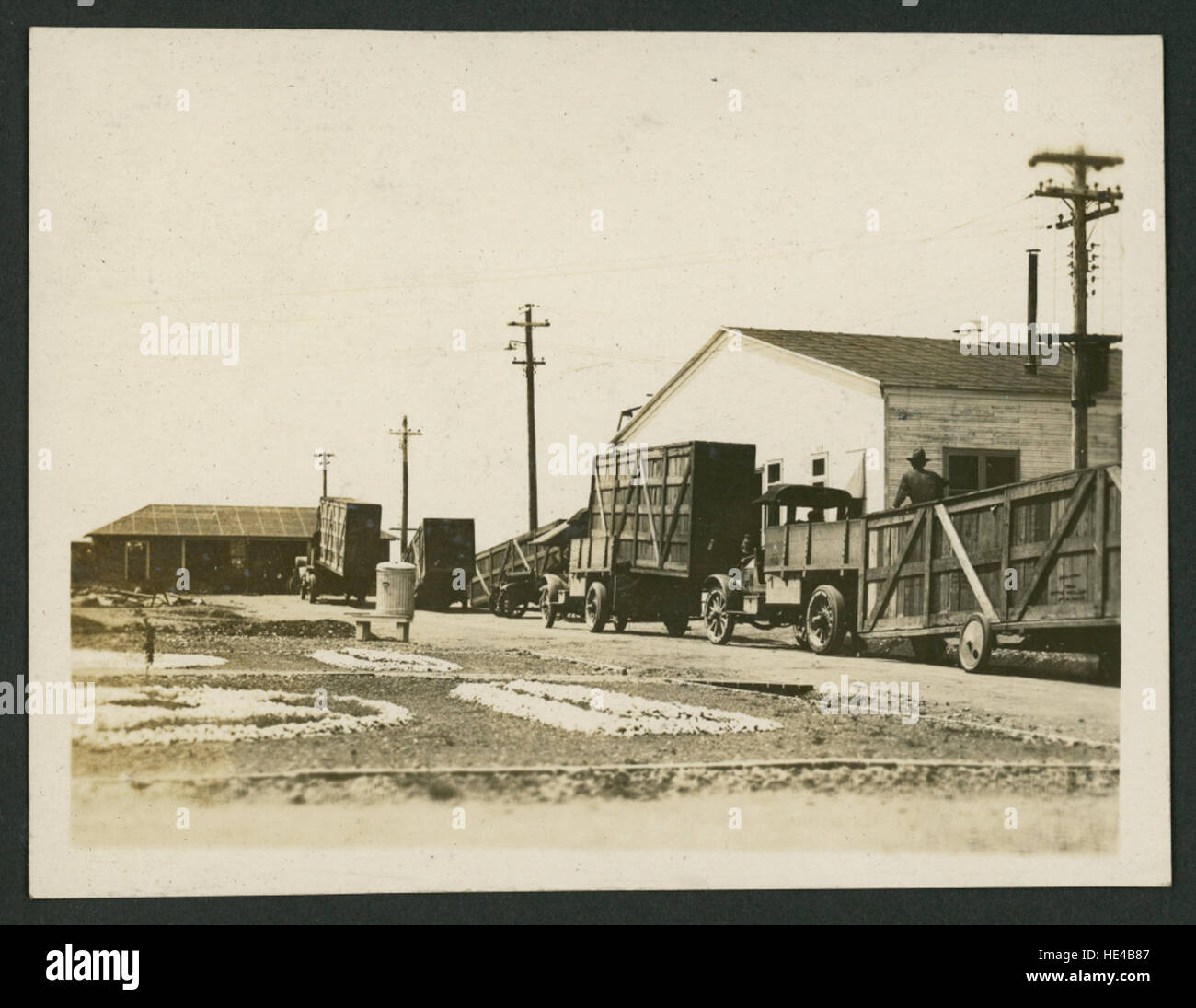 This historical image captures the delivery of military supplies at ...