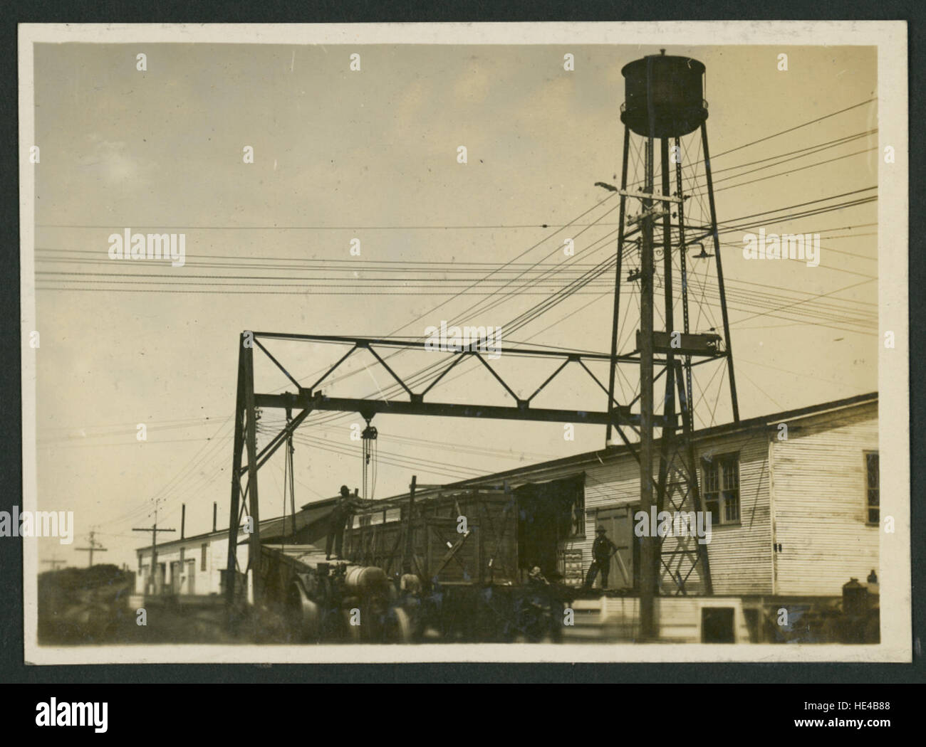 This historic photograph captures the railroad loading dock at Love ...