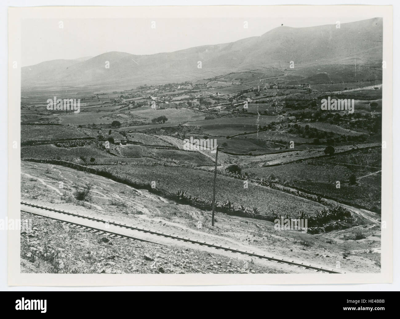 This photograph captures the old, historic railroad tracks, offering a ...