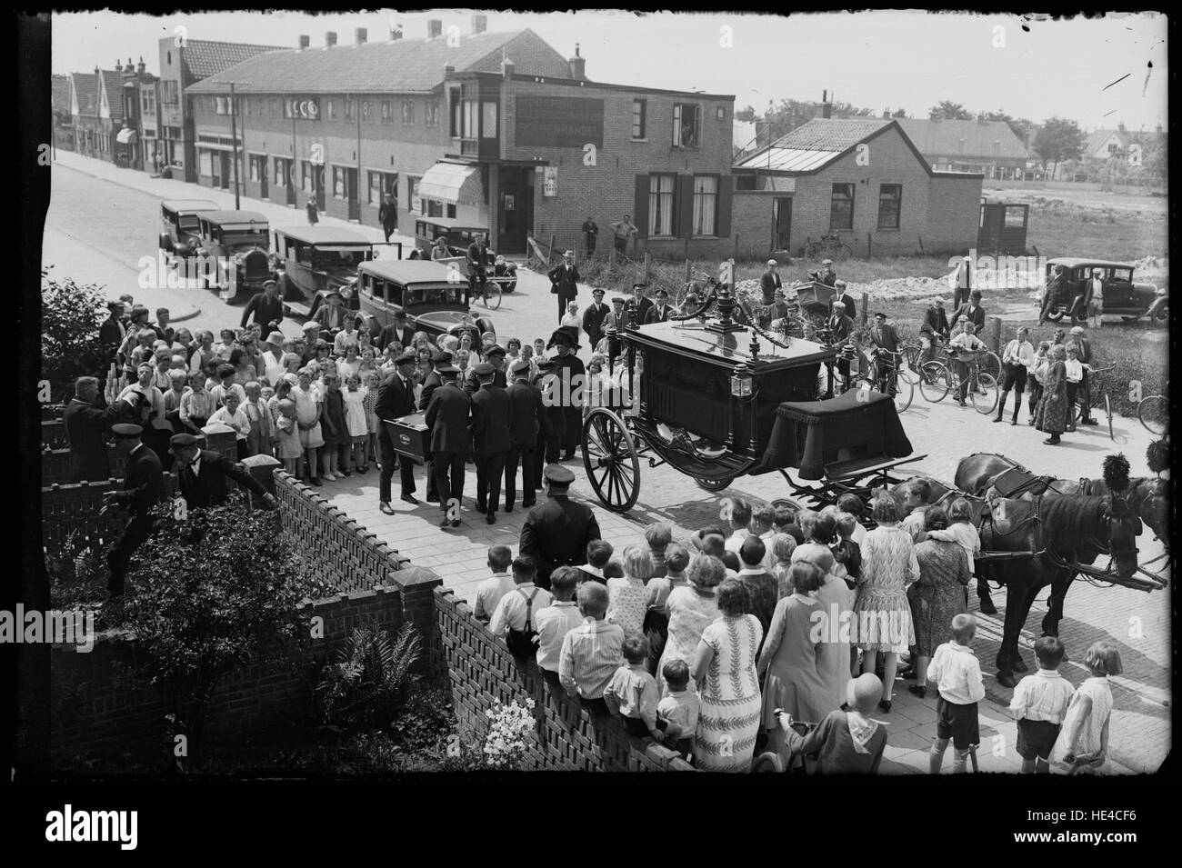 A funeral procession in Florastraat, Den Helder, Netherlands, capturing ...