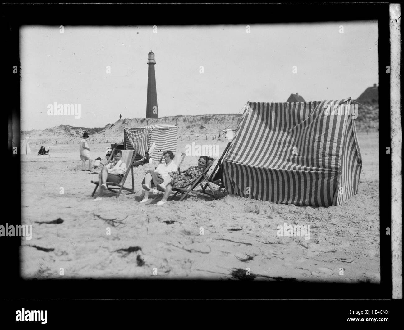Beach scene at Den Helder, including Huisduinen and lighthouse ...