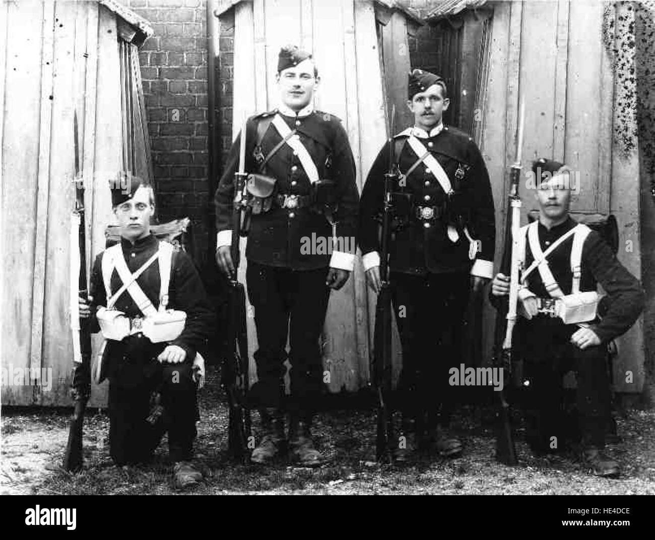 A photograph showing four riflemen taken around 1910, offering a ...