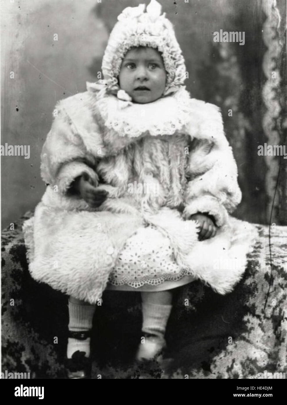 Child in woolly clothing, circa 1910, historical image Stock Photo - Alamy
