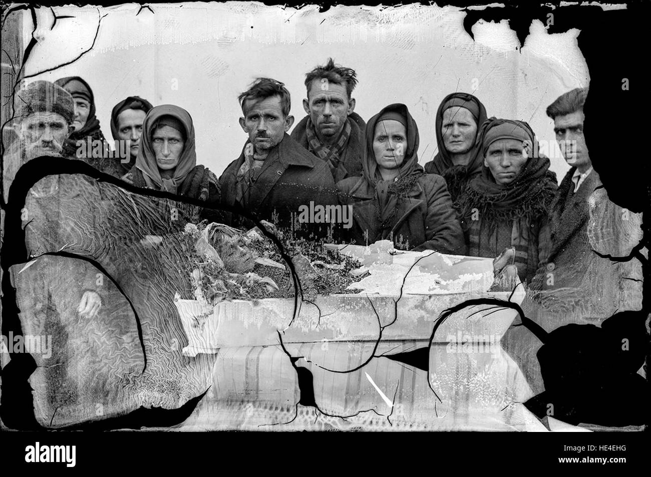 A traditional wake ceremony in Ialomița, Romania, captured in a vintage ...