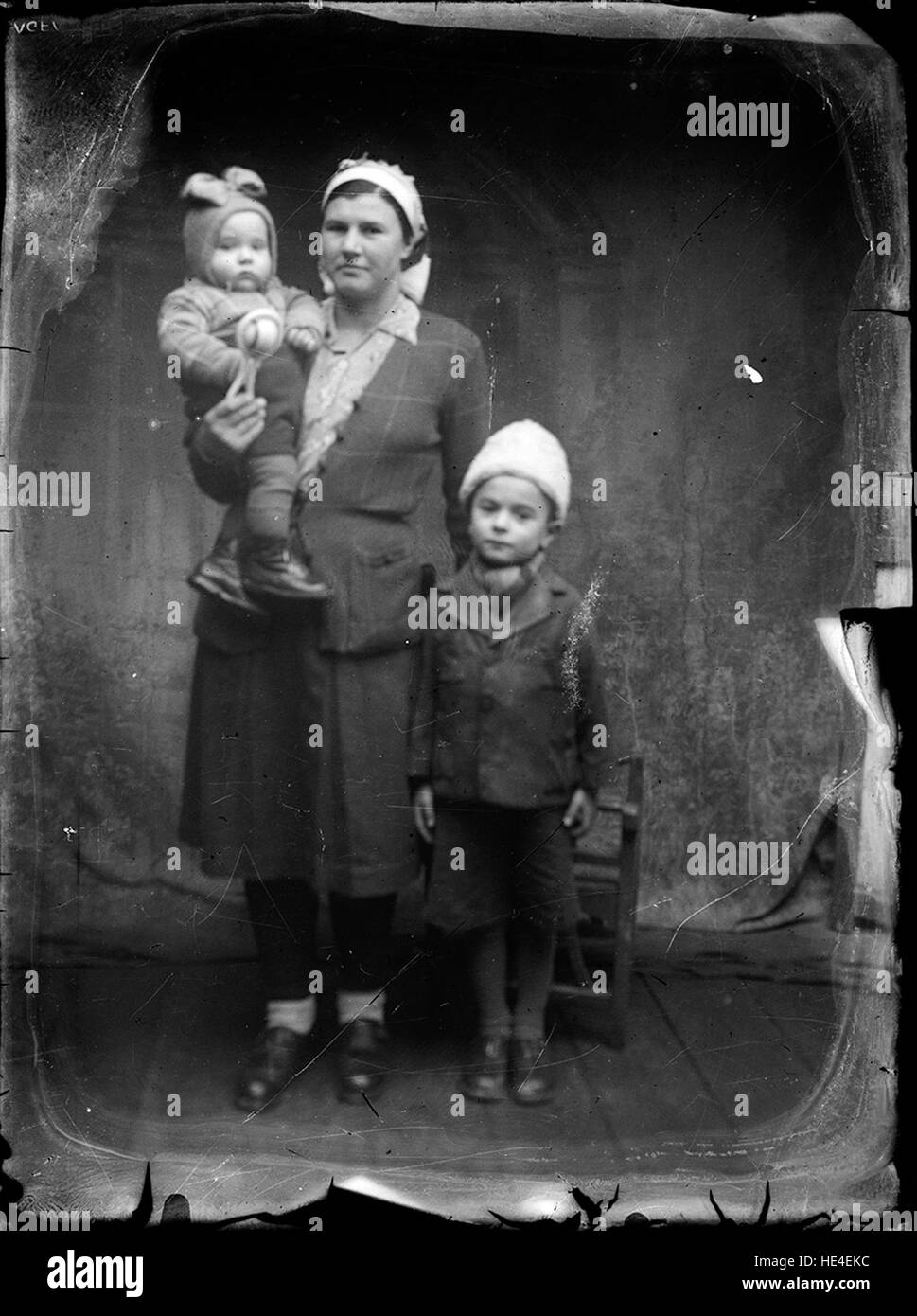 A portrait of a mother with two children from rural Romania, captured ...