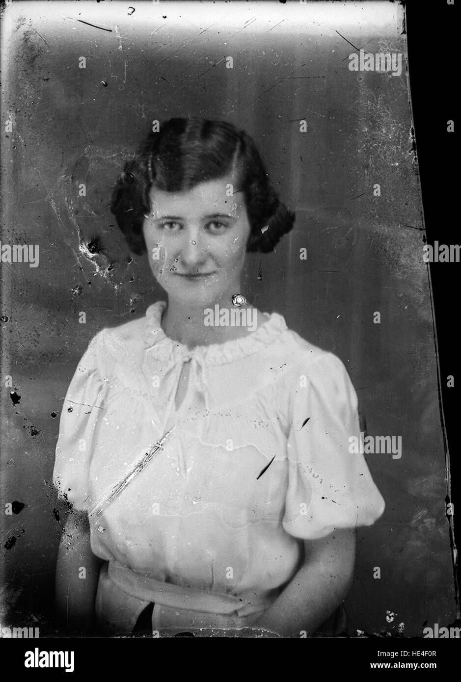 A Romanian woman in a white dress, captured in an early 20th-century ...