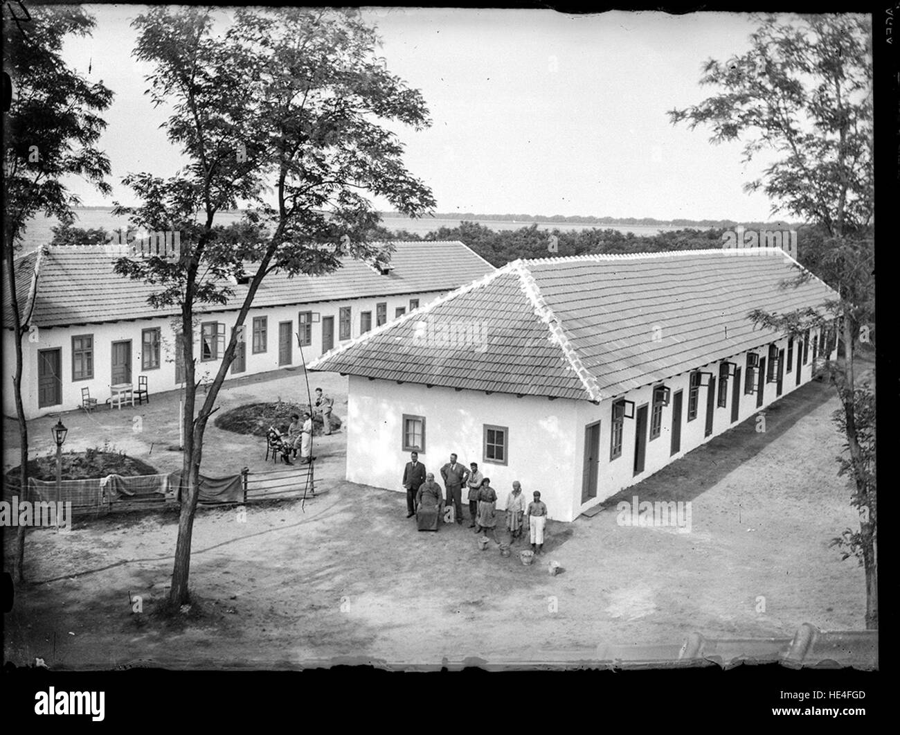 A group of people posing in front of a building in Amara, Romania. This ...