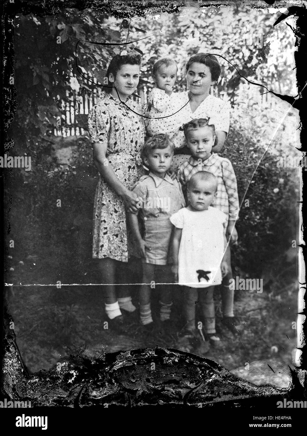 A photograph of a Romanian family captured in a vintage style by ...