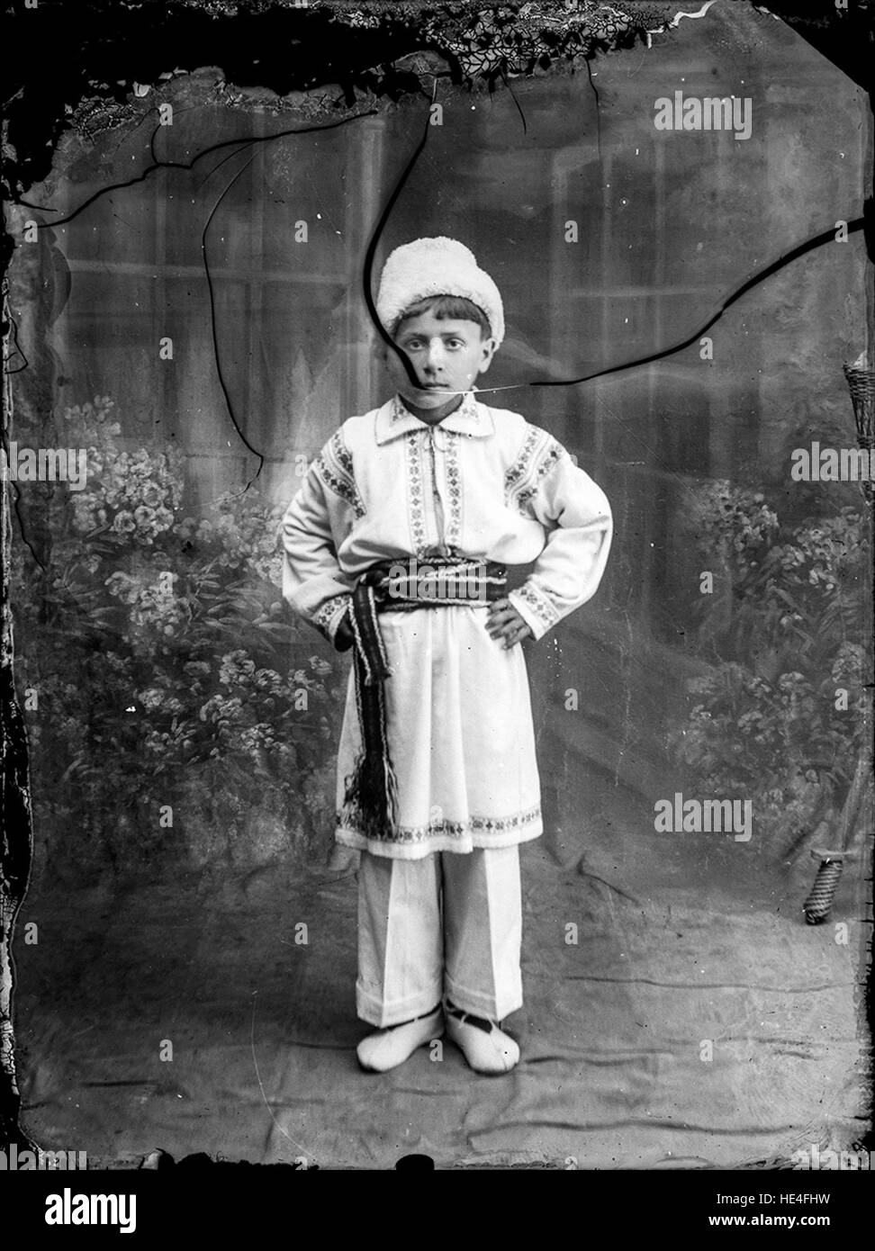 A Romanian child dressed in traditional folk costume, captured in a ...