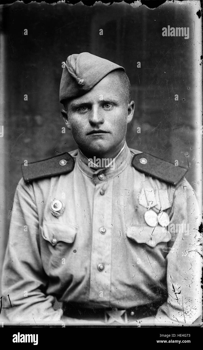 A photograph of a Soviet soldier dressed in the 1943 urban uniform ...
