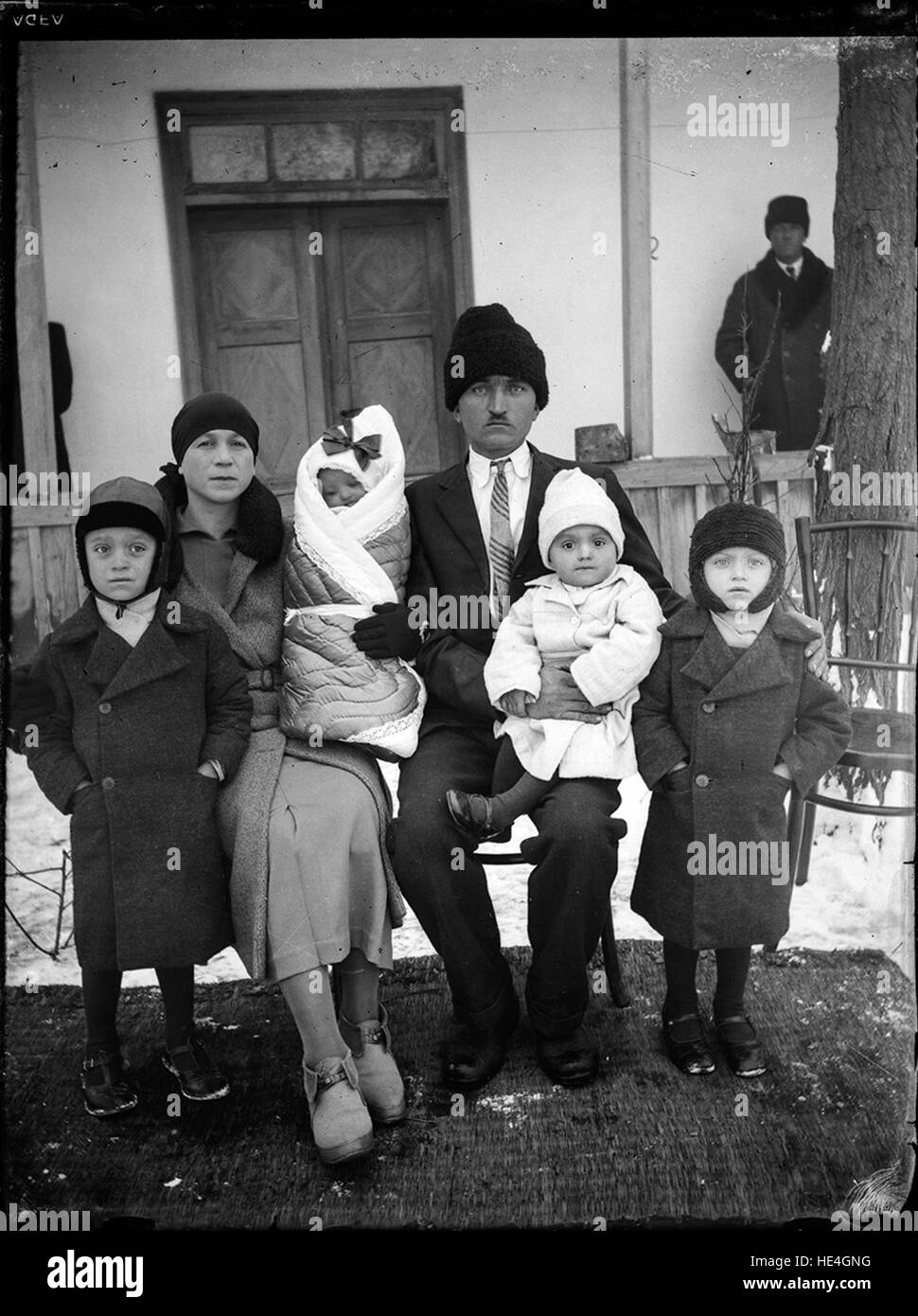 A family portrait captured in early 20th century Romania, showing the ...