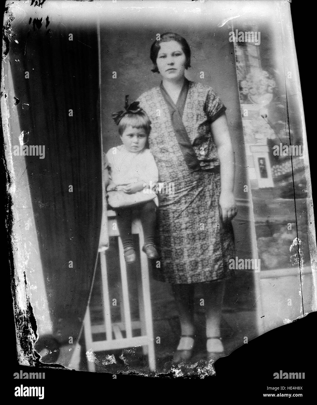A reproduction of a mother and child portrait captured in a glass plate ...