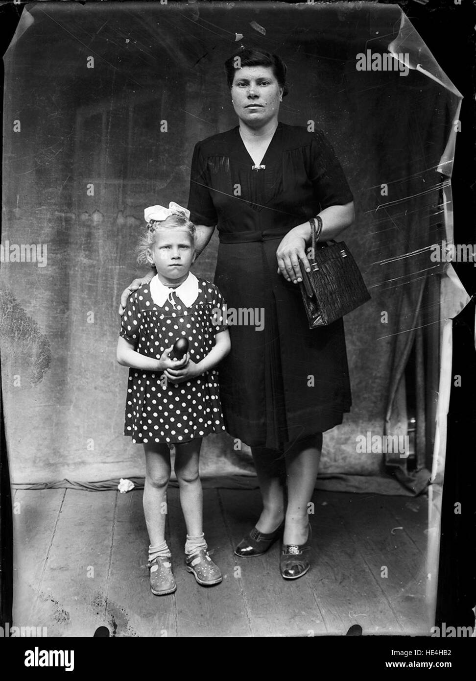 A historic photograph of a Romanian mother with her child, taken by ...