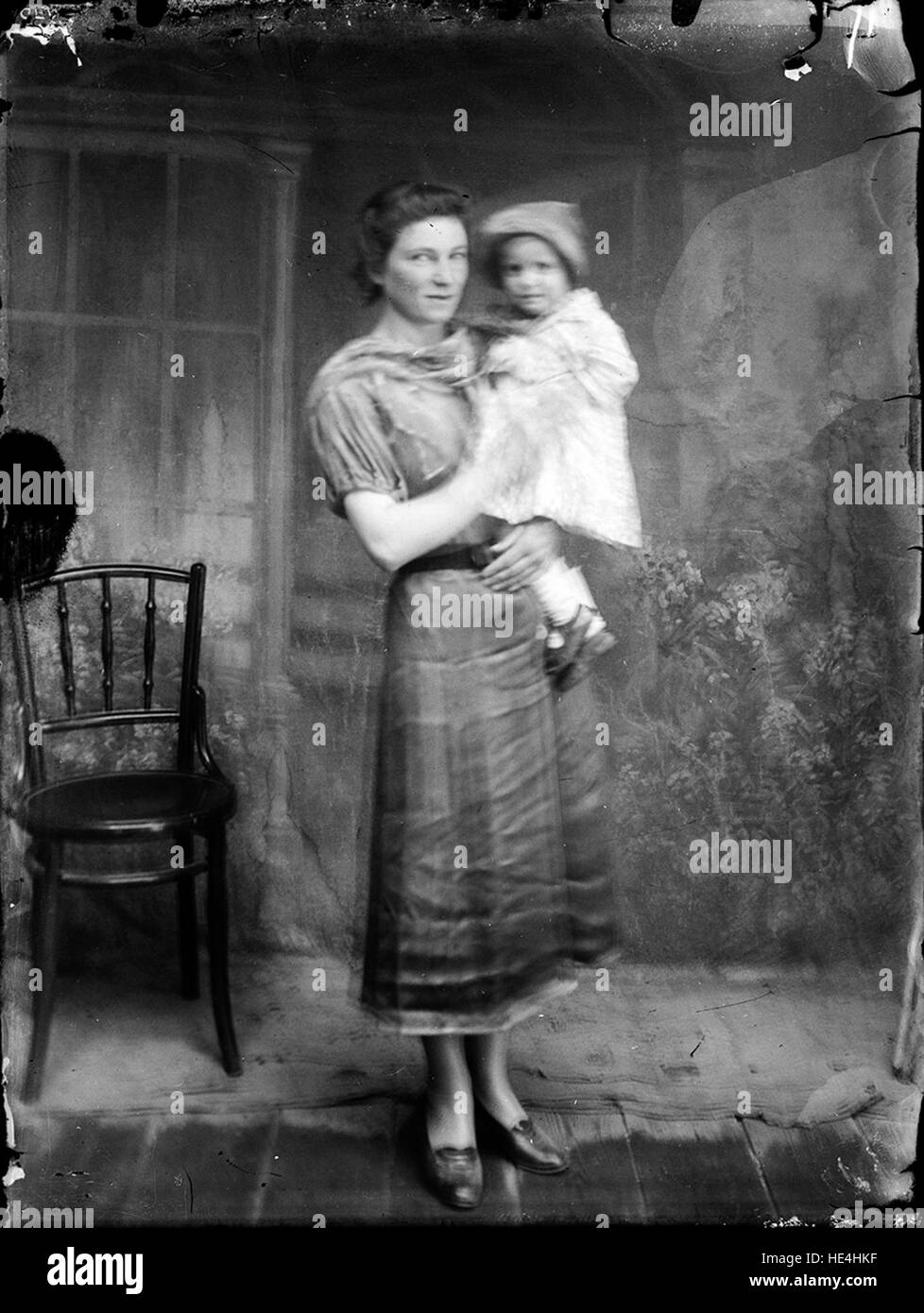 A photograph of a mother with her child, captured in Romania during the ...