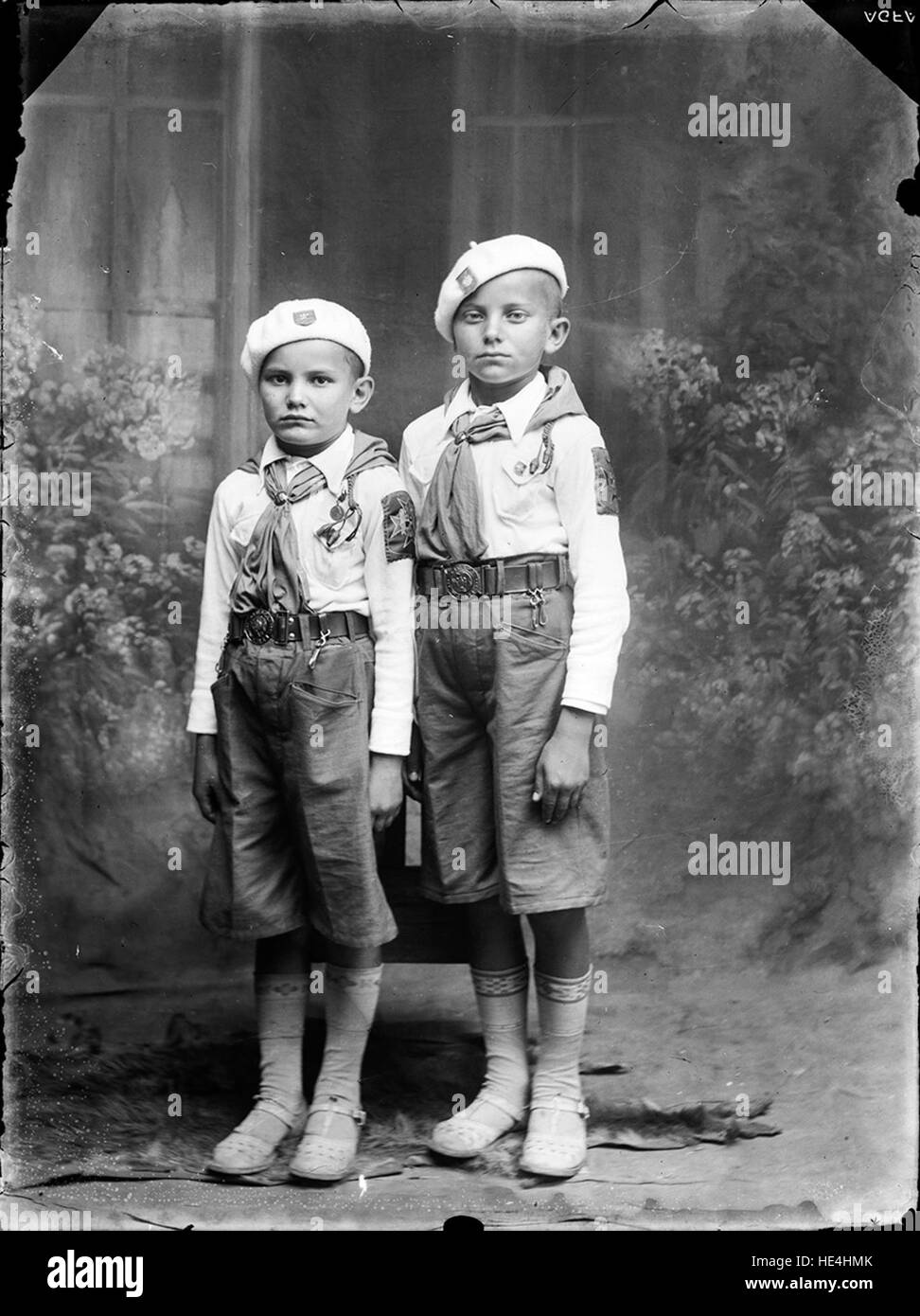 A black-and-white photograph of two children dressed in watchman ...
