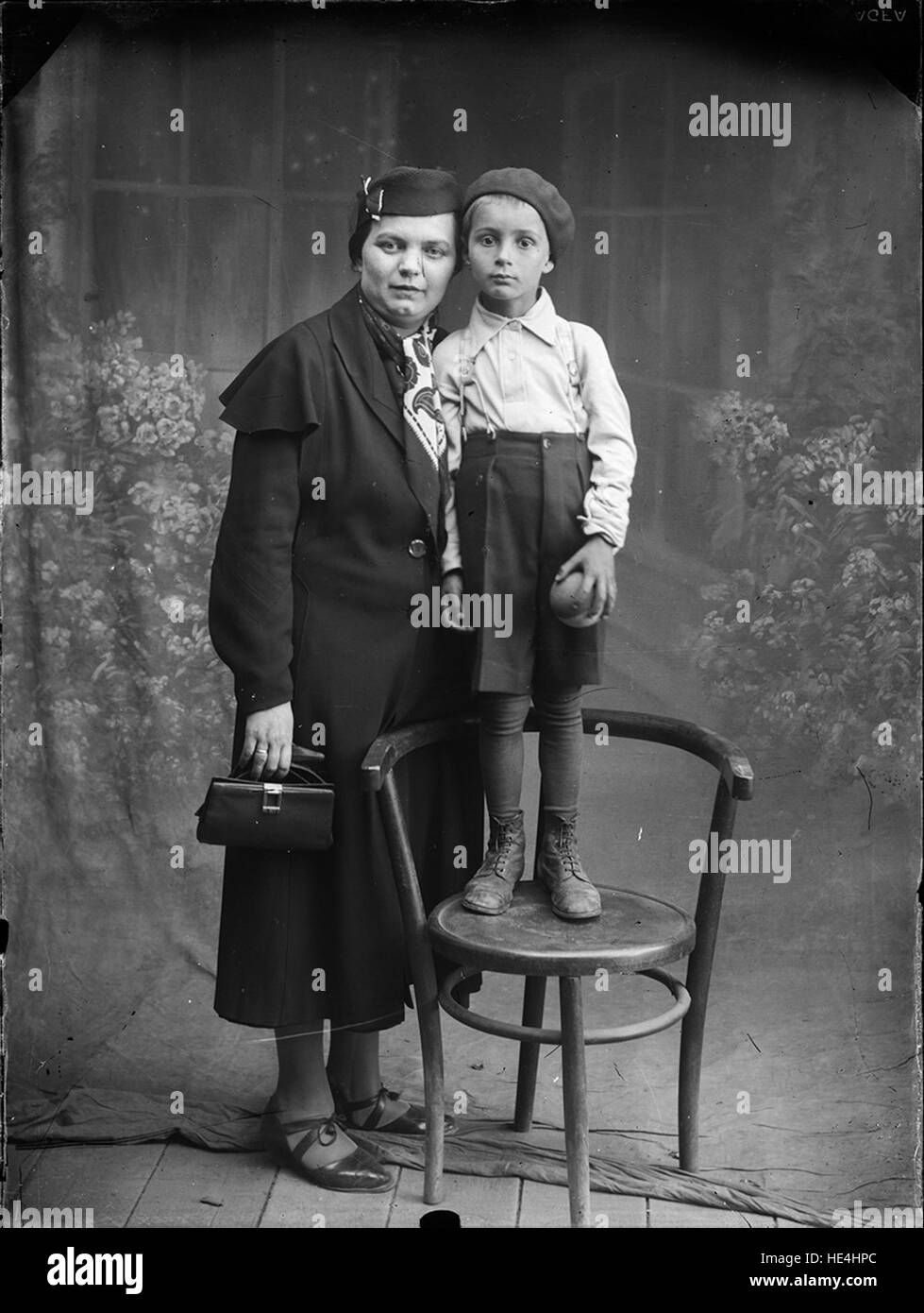 A photograph from the Costica Acsinte Archive of a Romanian mother with ...