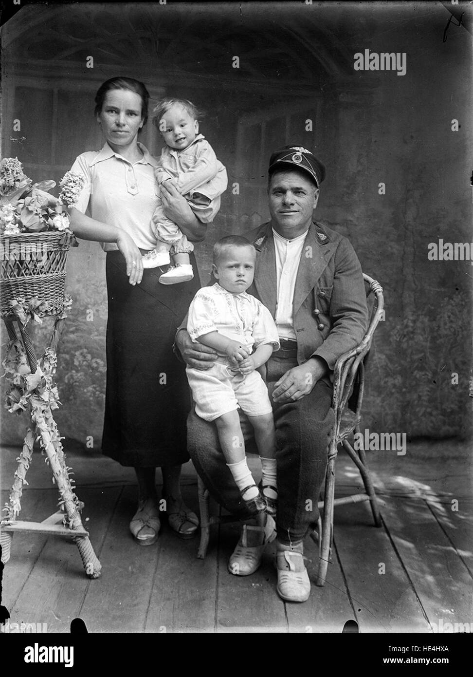 A historic photograph of a Romanian family, featuring a father in a ...