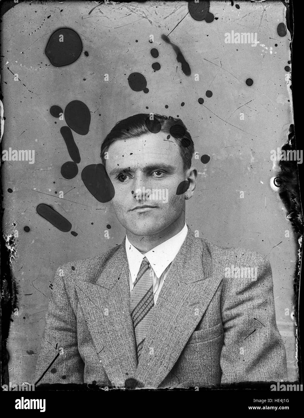 A photograph of a man with chemical stains on his clothing, captured by ...