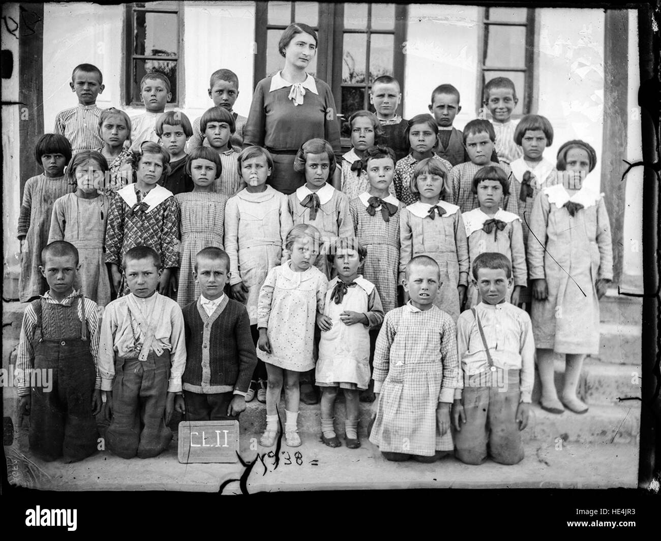 A historic school photograph of a Romanian class of children, taken on ...