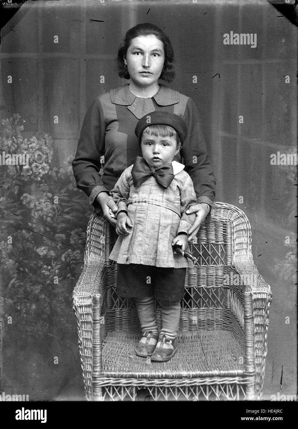 A second historic photograph of a Romanian mother holding her child ...
