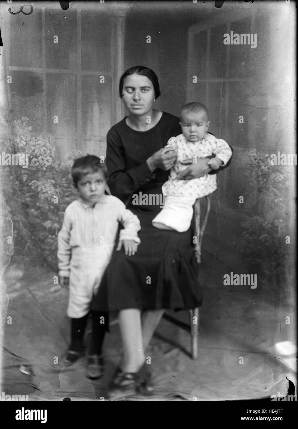 A historic photograph of a Romanian mother with her two children, taken ...