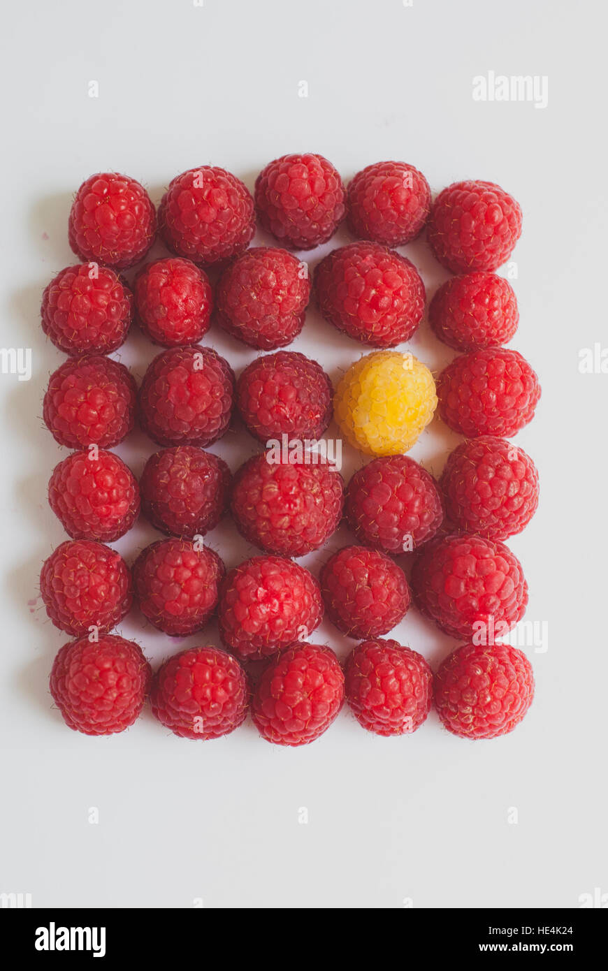 Red and yellow raspberries on a white background Stock Photo - Alamy