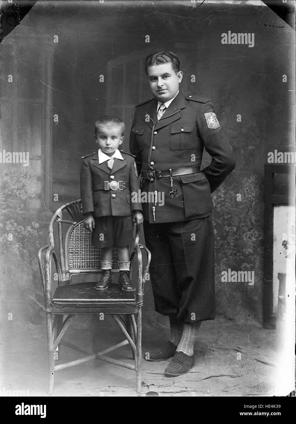 Man (possibly father) with child in historical photograph, representing ...