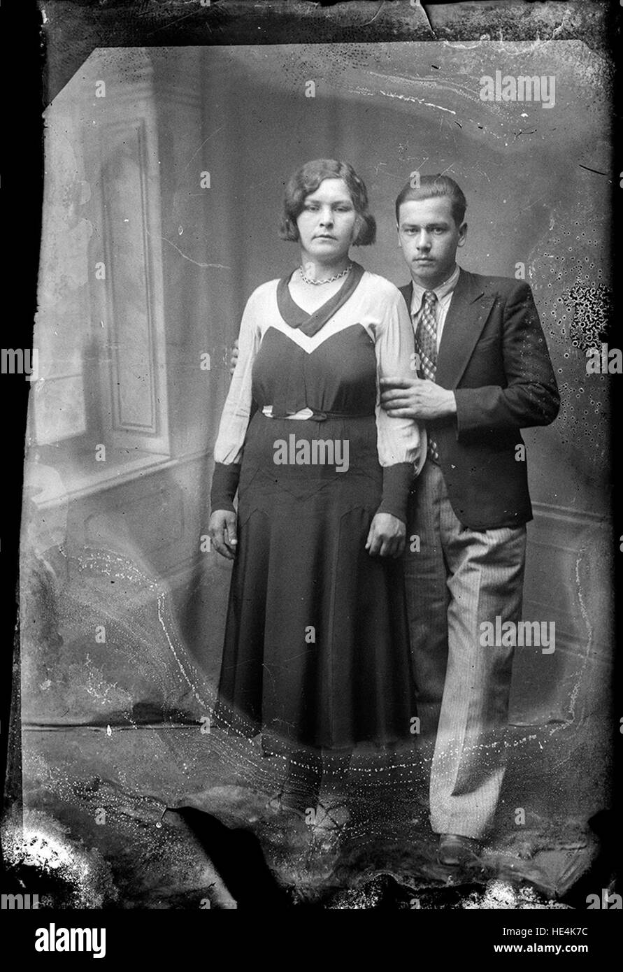 A historic portrait of a Romanian mother with two children. The image ...