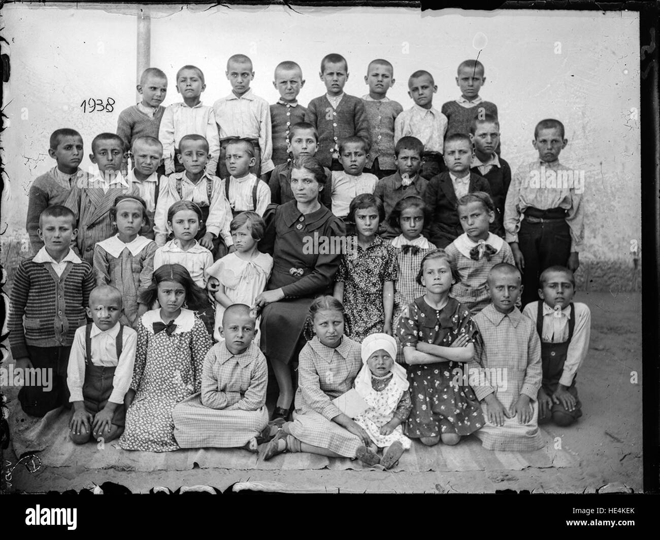 Group of children in Romania, 1938, captured in a historical portrait ...