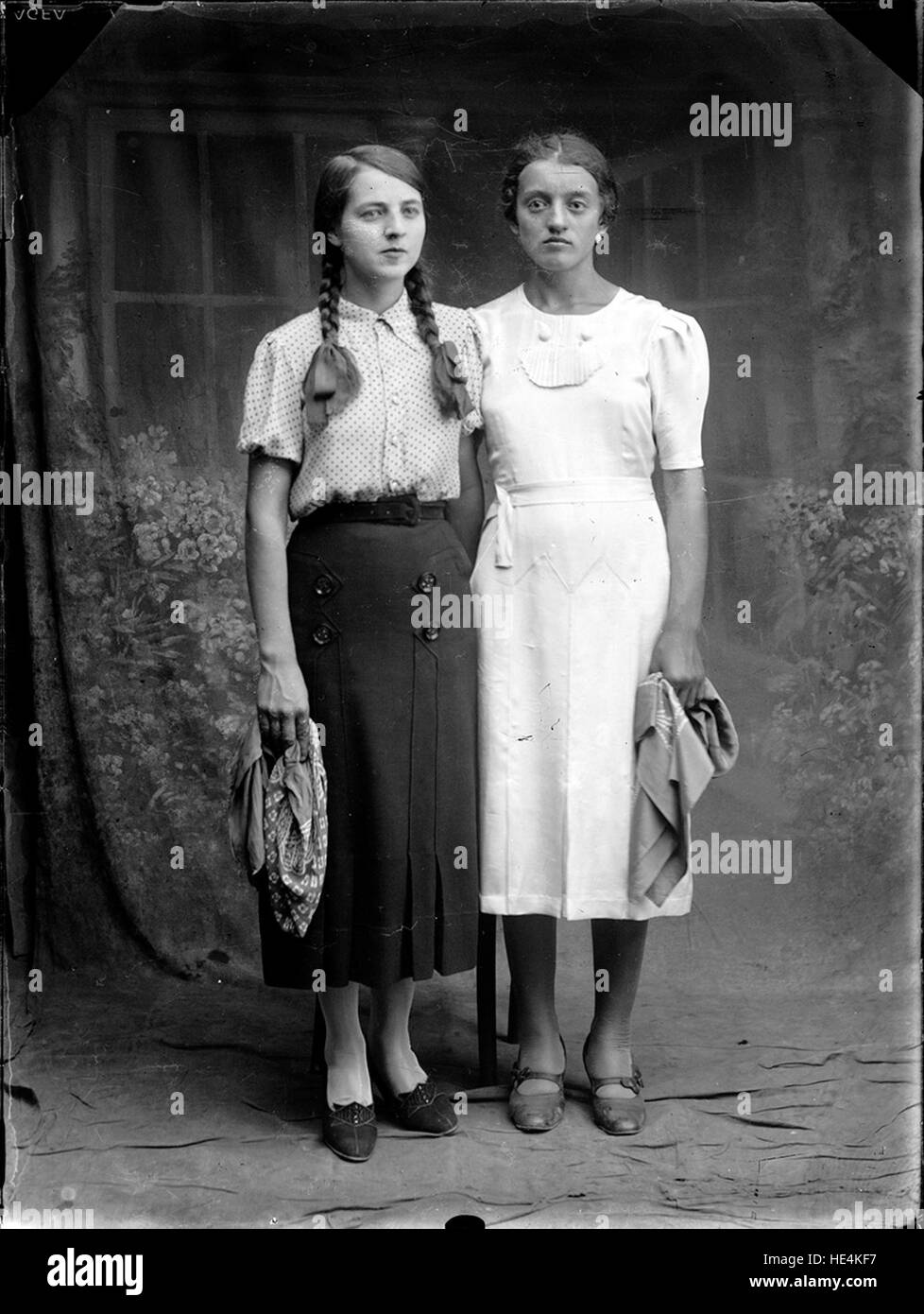 A historic glass plate photograph of two women in Ialomita, Romania ...
