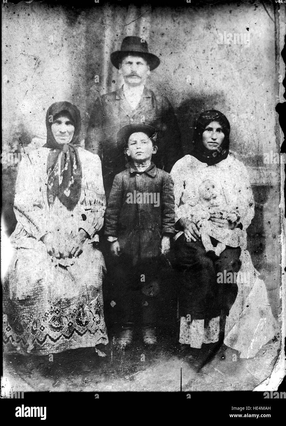 A family portrait from early 20th century Romania, preserved on a glass ...