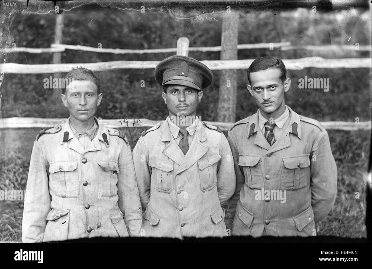 Two photographs of Romanian soldiers in 1940, showcasing military uniforms and equipment during ...