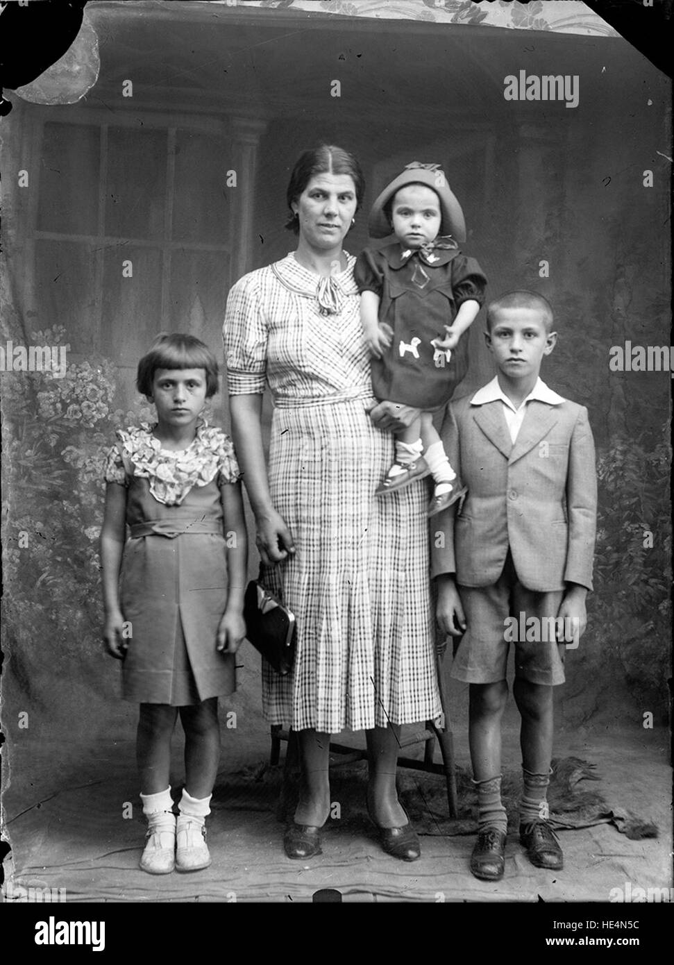 A mother with her children, captured in a Romanian glass plate negative ...