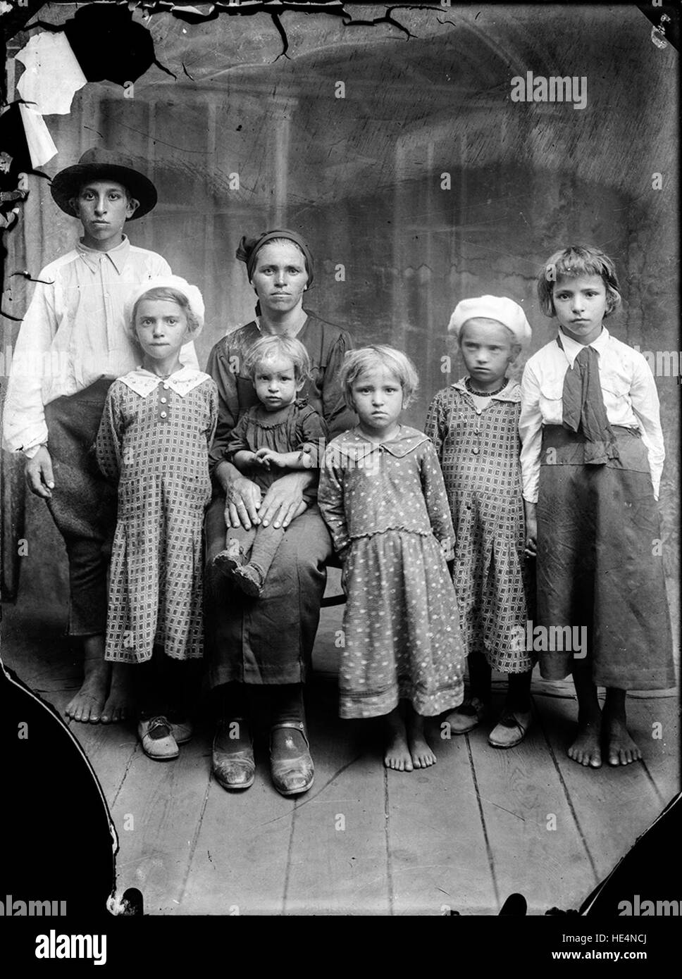 A historical image of a mother with her six children, captured in ...