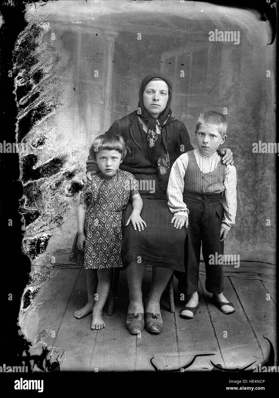 A glass plate photograph of a mother with two children from Ialomita ...