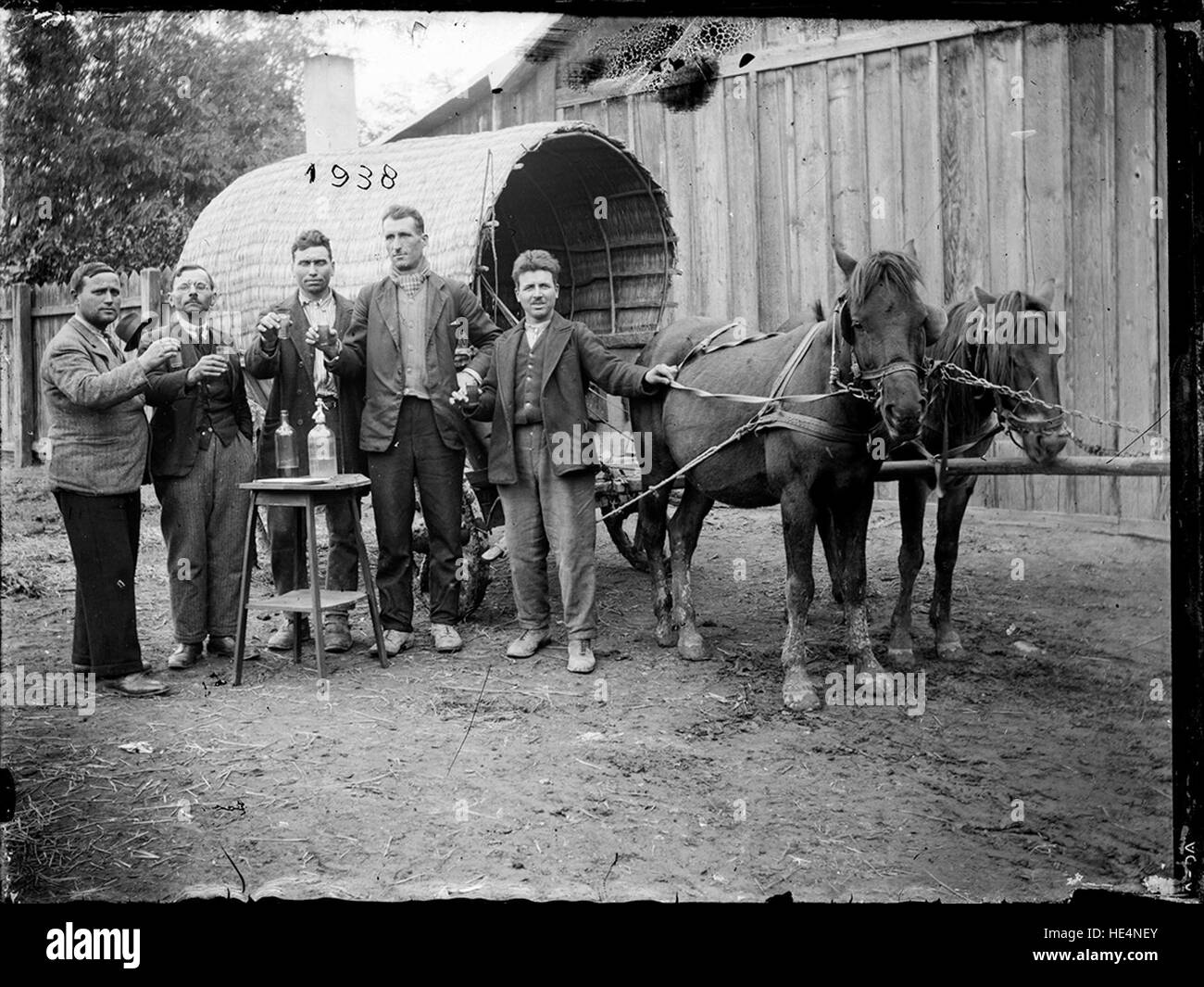 A group of people with a cart photographed in Ialomița, Romania, in ...