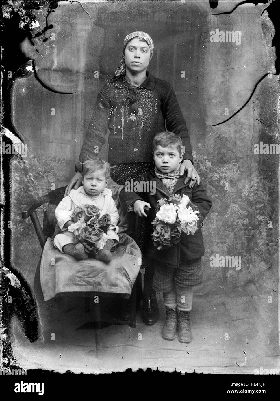 A historic photograph of a Romanian mother with her two children, taken ...