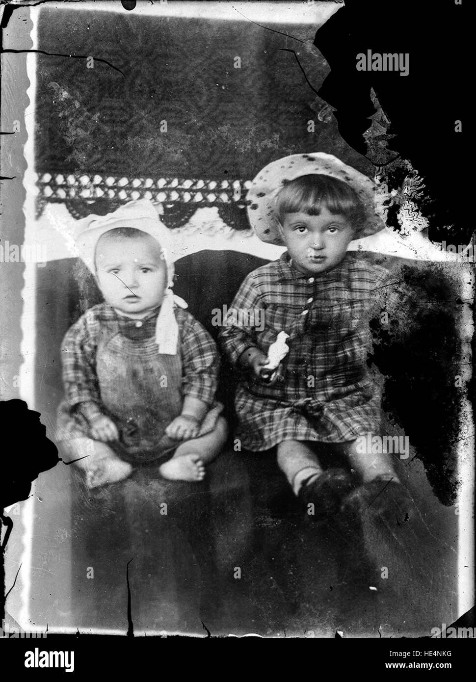 A reproduction of a photograph featuring two children from Ialomita ...