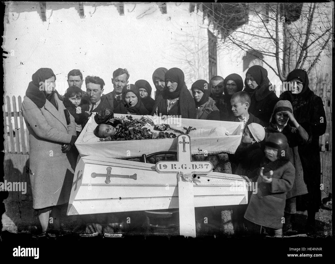 A funeral scene from 1937 in Ialomița, Romania, captured on glass ...