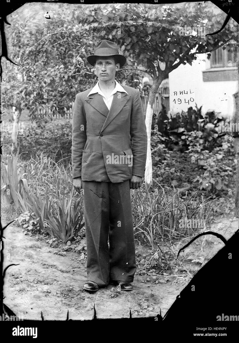 A portrait of a man in Romania, captured in 1940, reflecting the ...