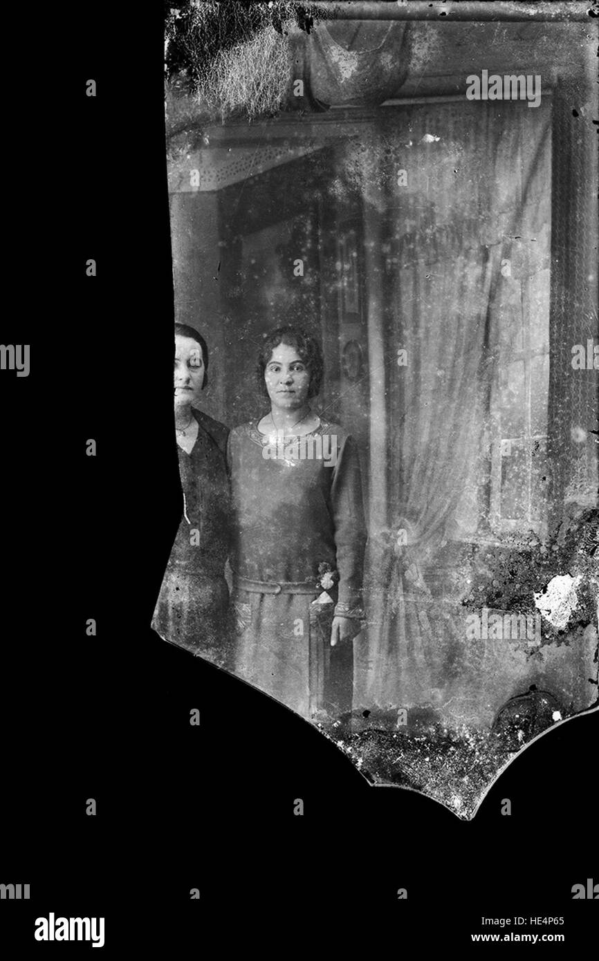Two Romanian women captured on glass plates, depicting rural life in ...