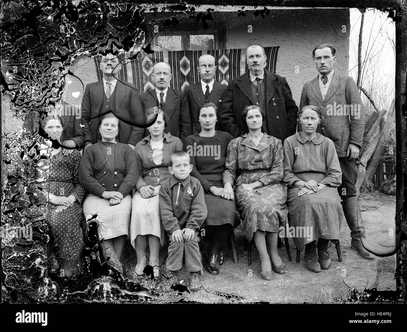 A group portrait captured on a glass plate, depicting rural Romanian ...